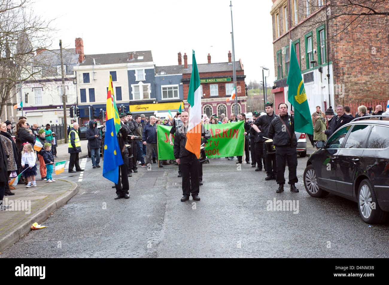 Liverpool Irish Patriots band lead the parade, with several flags ...