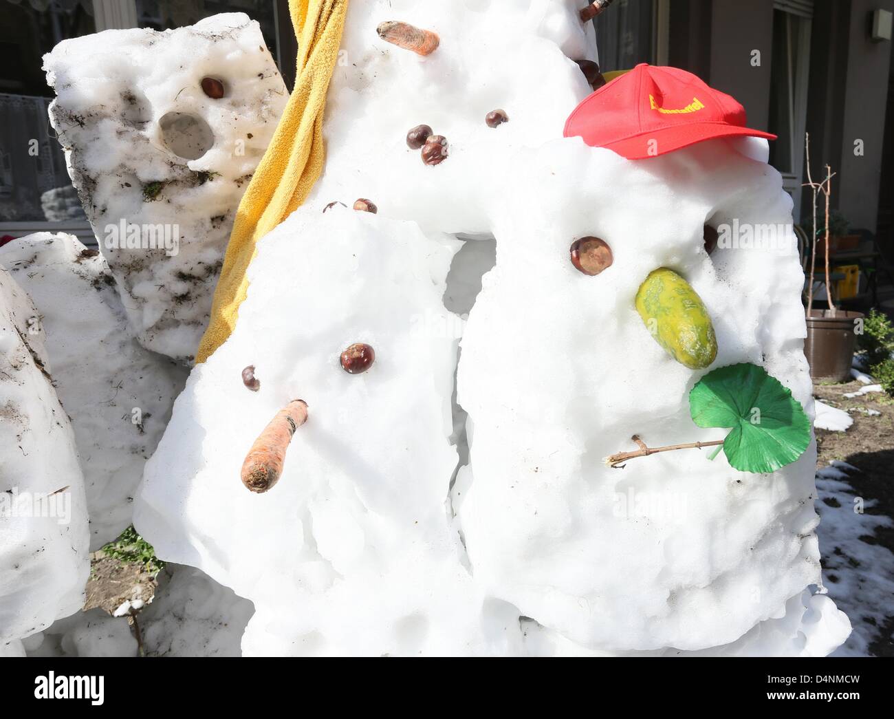 A group of snowmen is pictured in a garden in Berlin, Germany, 17 March ...