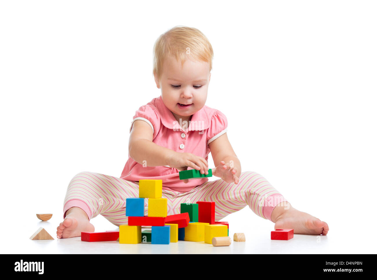 Happy child girl playing toy blocks isolated on white background Stock ...
