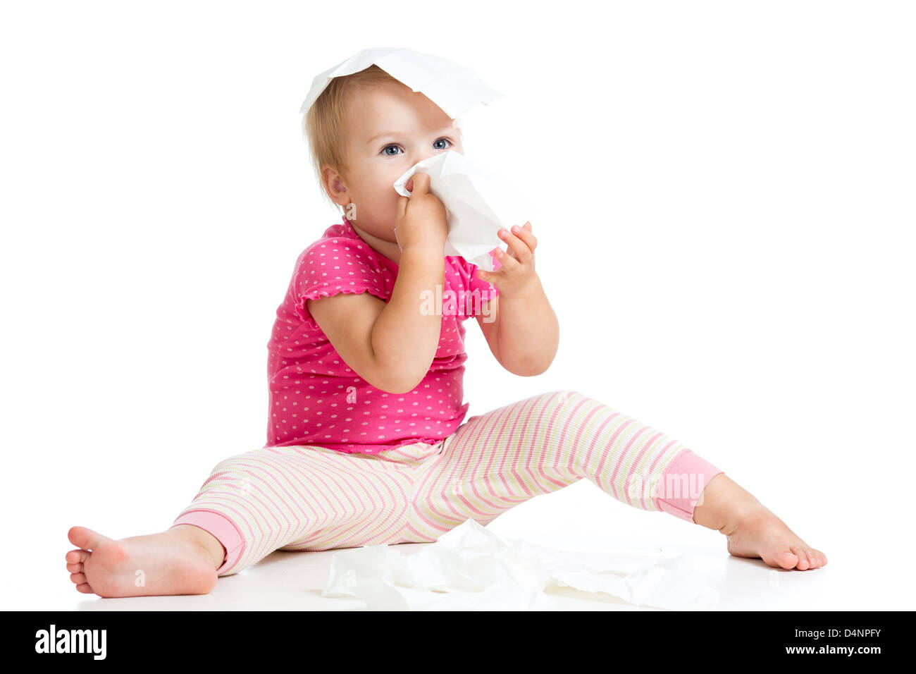 kid cleaning nose with tissue isolated on white Stock Photo - Alamy