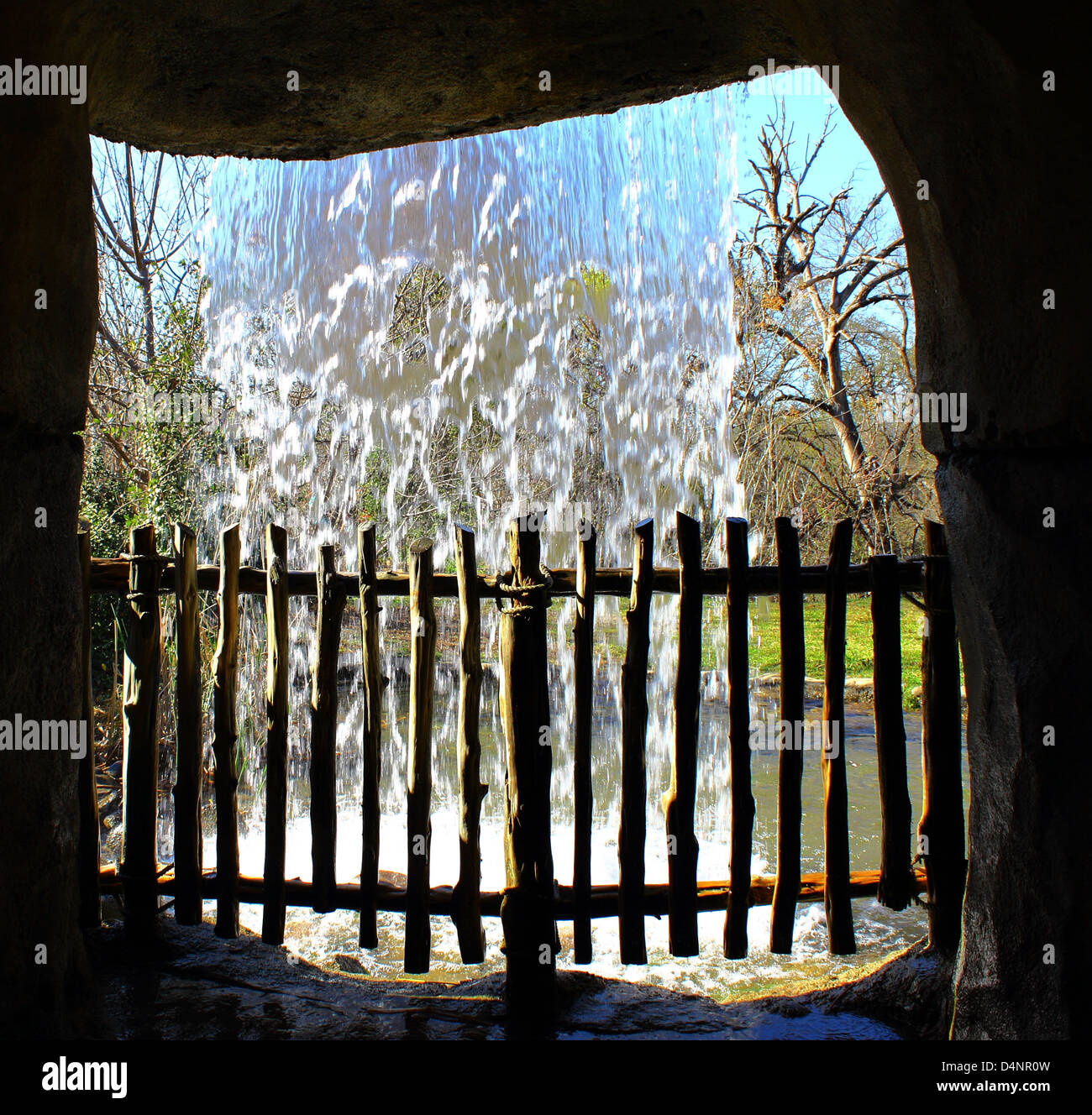 beautiful water falling in a cave Stock Photo - Alamy