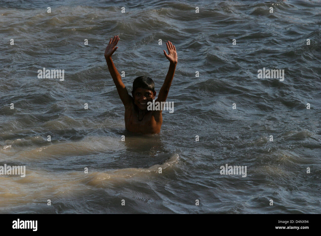 A young boy bathing in the Ganges at Haridwar's Har Ki Pairi Ghat Stock ...