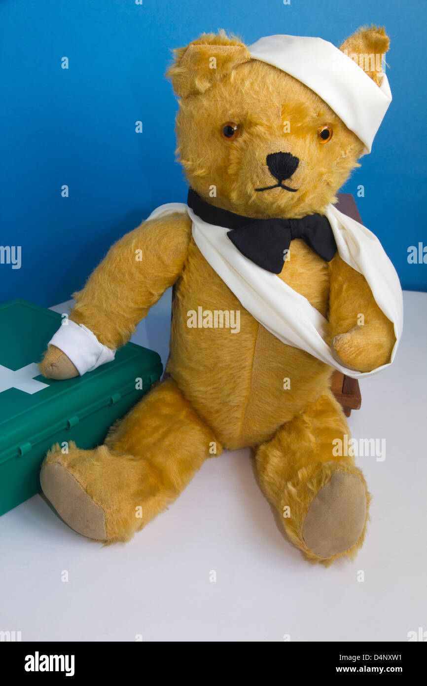 Teddy Bear vintage well worn with first aid Stock Photo - Alamy
