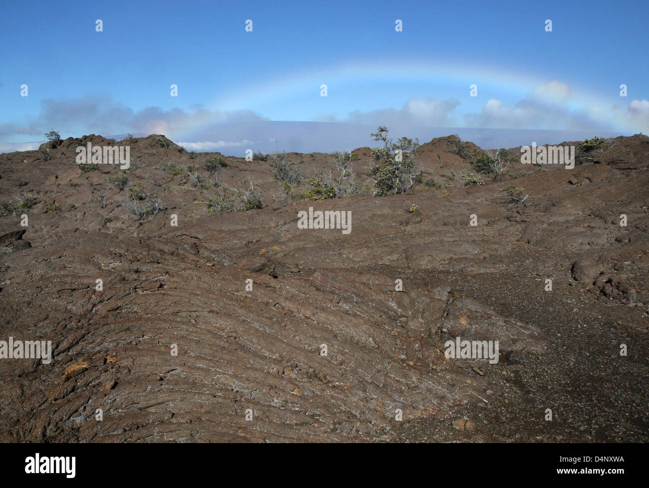 Rainbow over Old lava flow Kilauea Volcanoes National Park Hawaii the ...