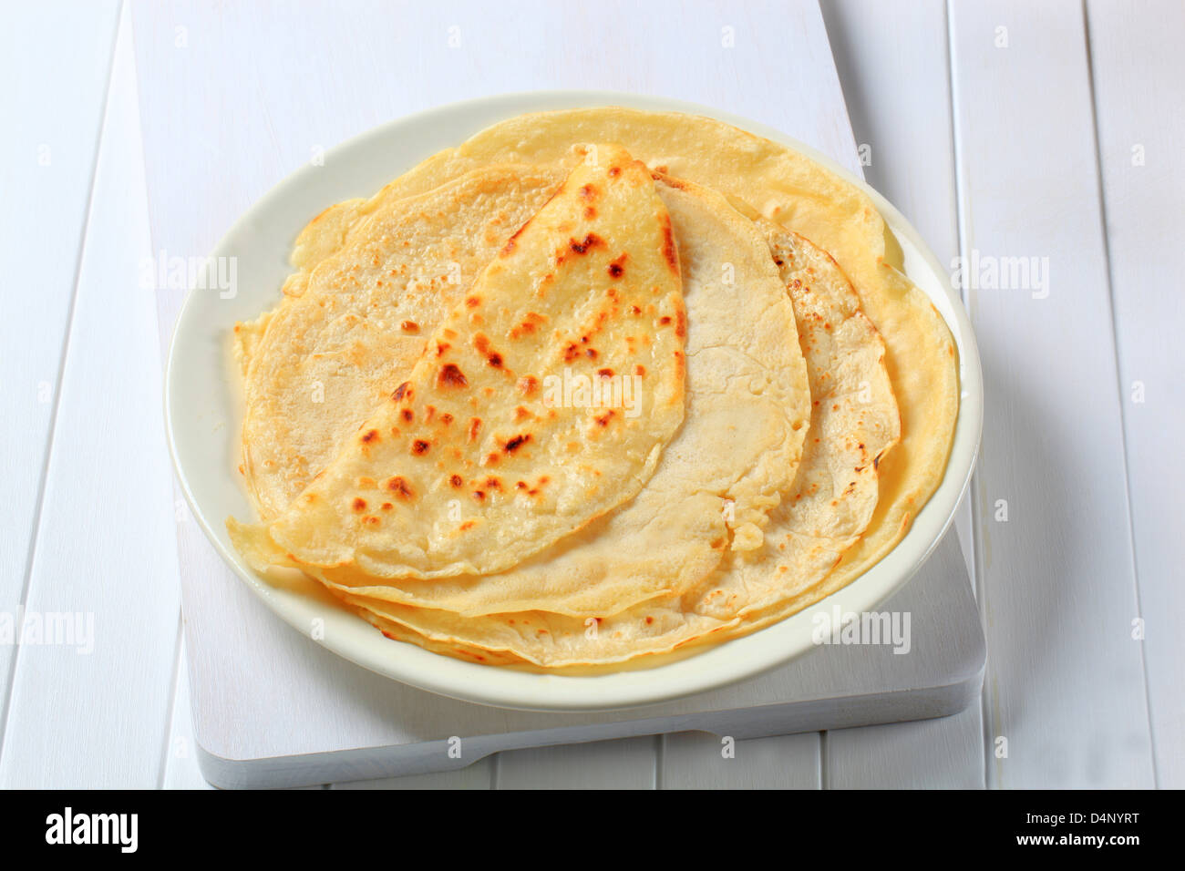 Stack of thin crepes on plate Stock Photo - Alamy