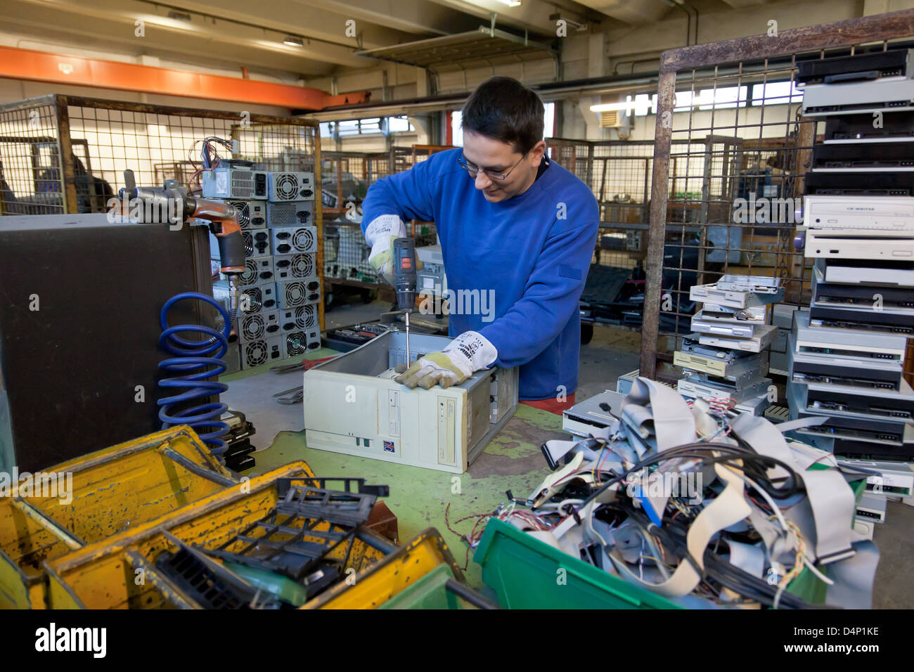 Berlin, Germany, the employee BRAL splits a computer into parts Stock ...