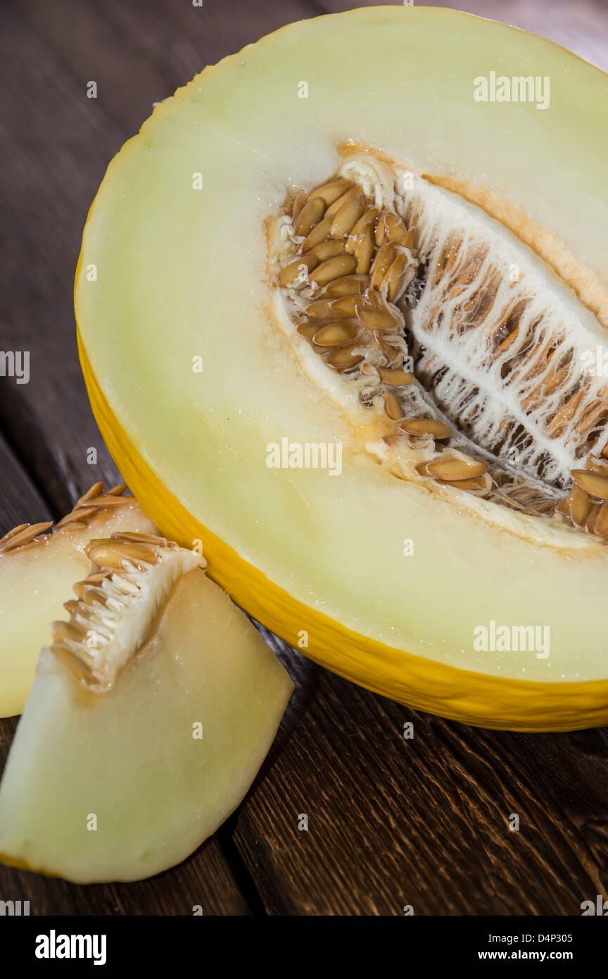 Fresh Honeydew on wooden background Stock Photo - Alamy