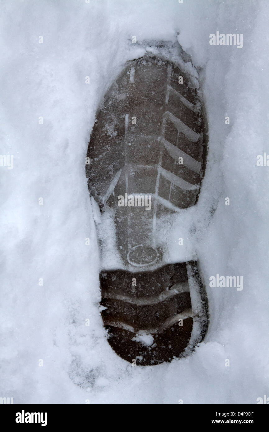 Footprint in Snow Stock Photo - Alamy