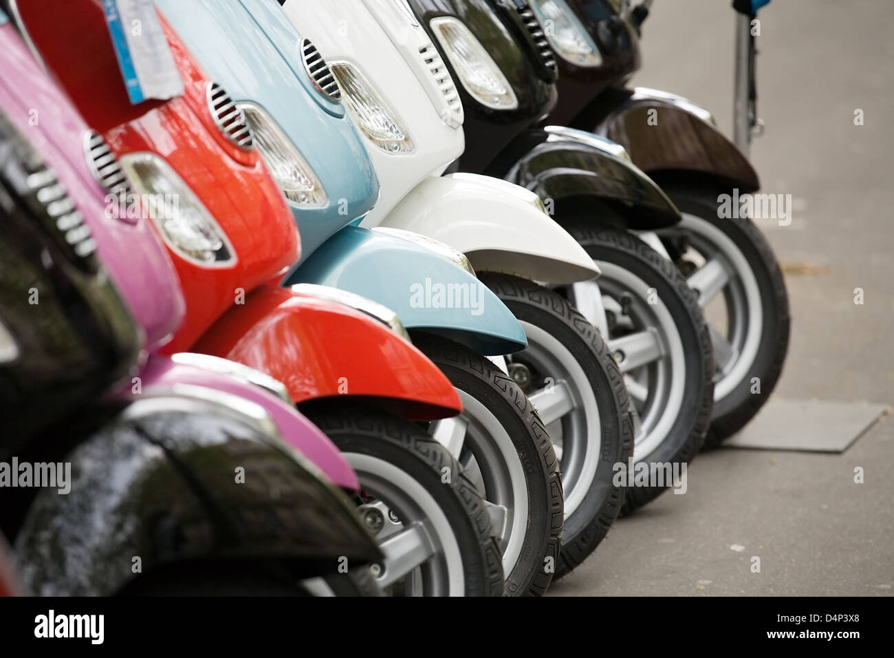 different color motorcycles standing in the row closeup Stock Photo - Alamy