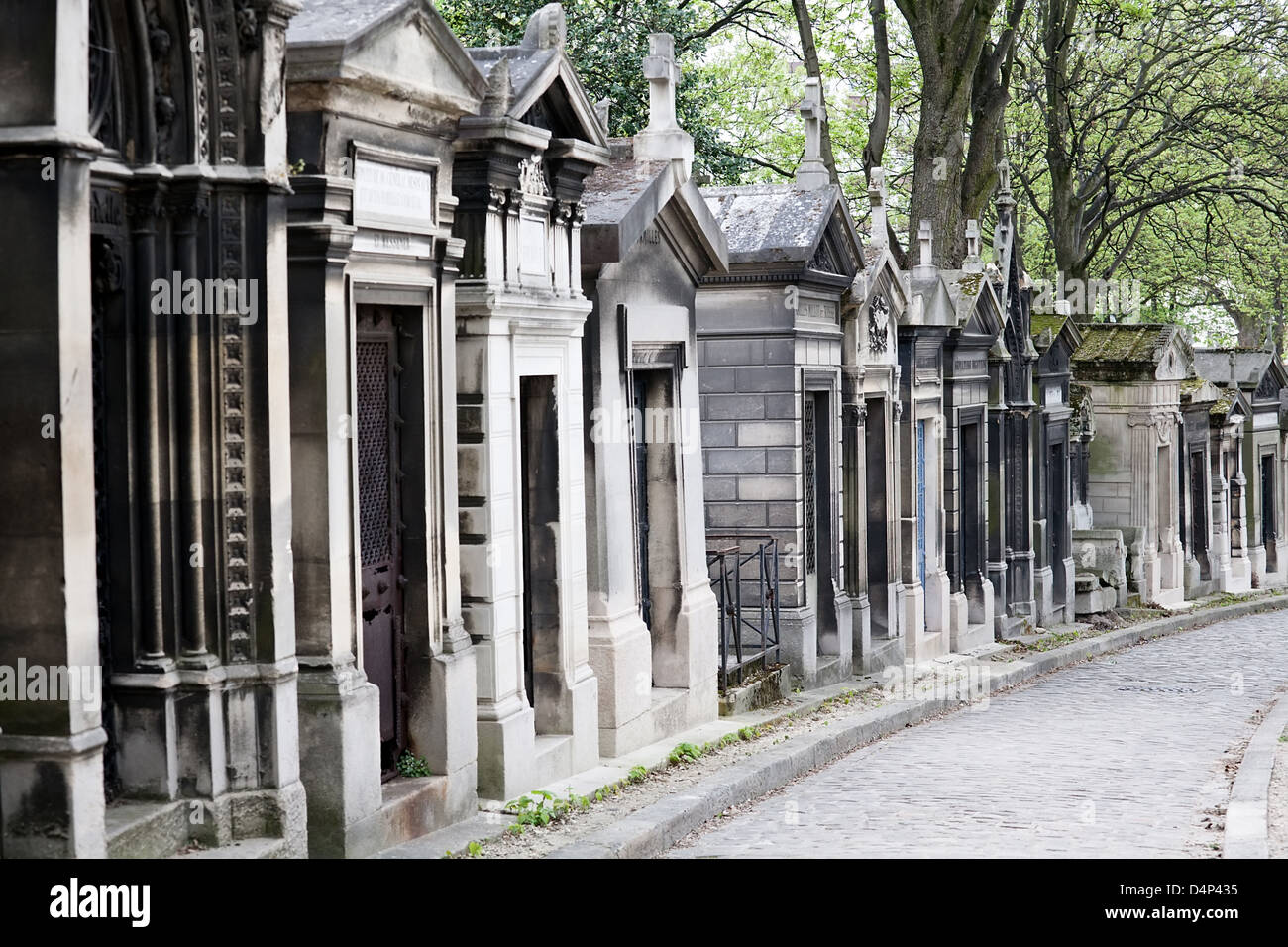 alley with line of stone crypts in Pere Lachaise cemetery, Paris Stock ...