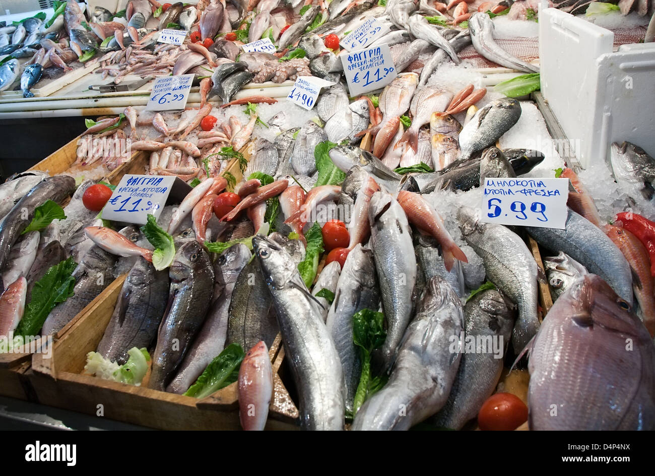 closeup of raw fresh fish in ice on market table Stock Photo - Alamy