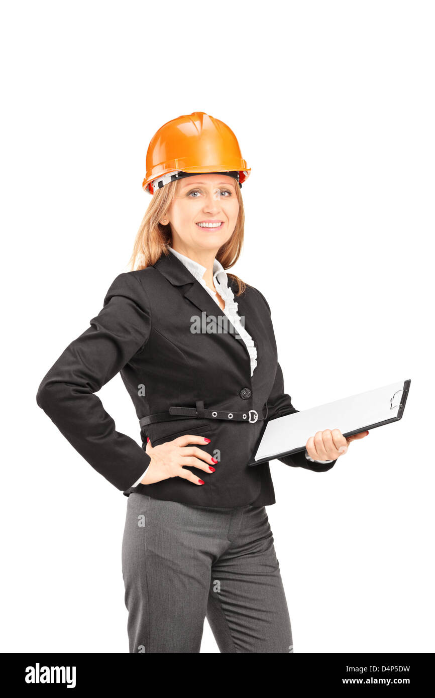 Female engineer with a helmet holding a clipboard and posing isolated ...