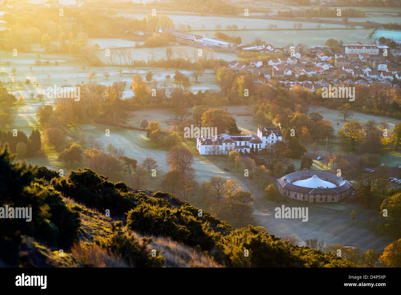 view to duddingston golf course from arthur's seat at sunrise on cold ...