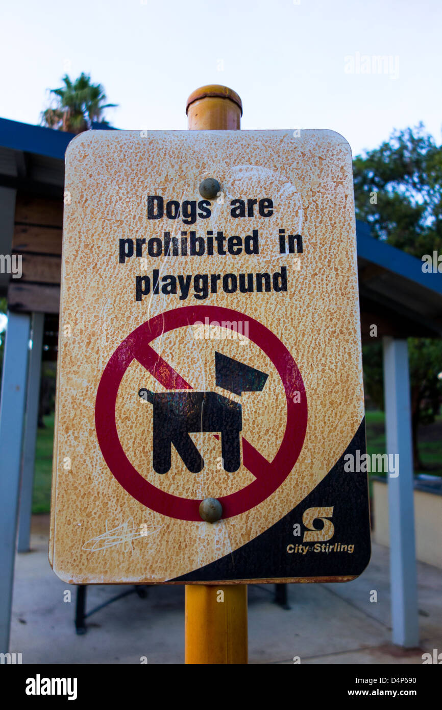 Dogs are prohibited in playground sign Stock Photo - Alamy