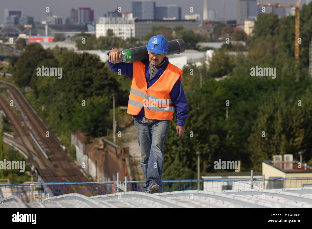 Berlin, Germany, Construction worker with a gas cylinder Stock Photo ...