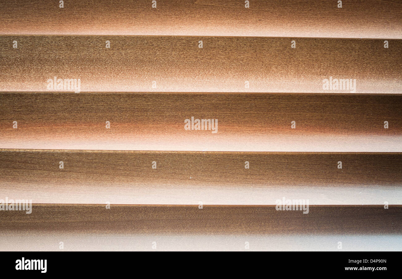 Dim light through wooden jalousie at a window Stock Photo - Alamy