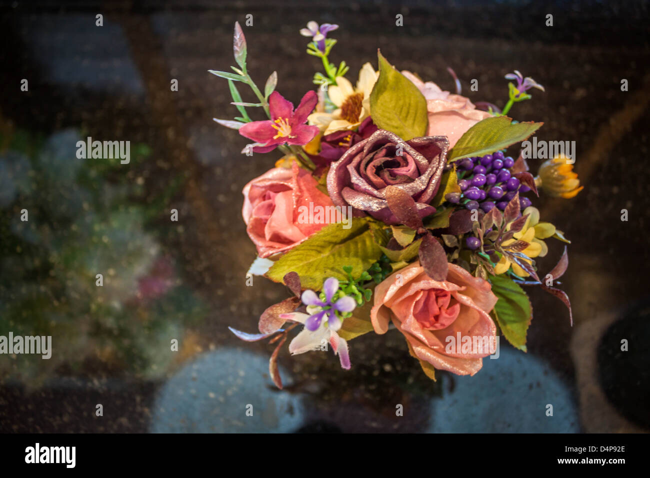 Beautiful colors of plastic flowers on granite table Stock Photo - Alamy