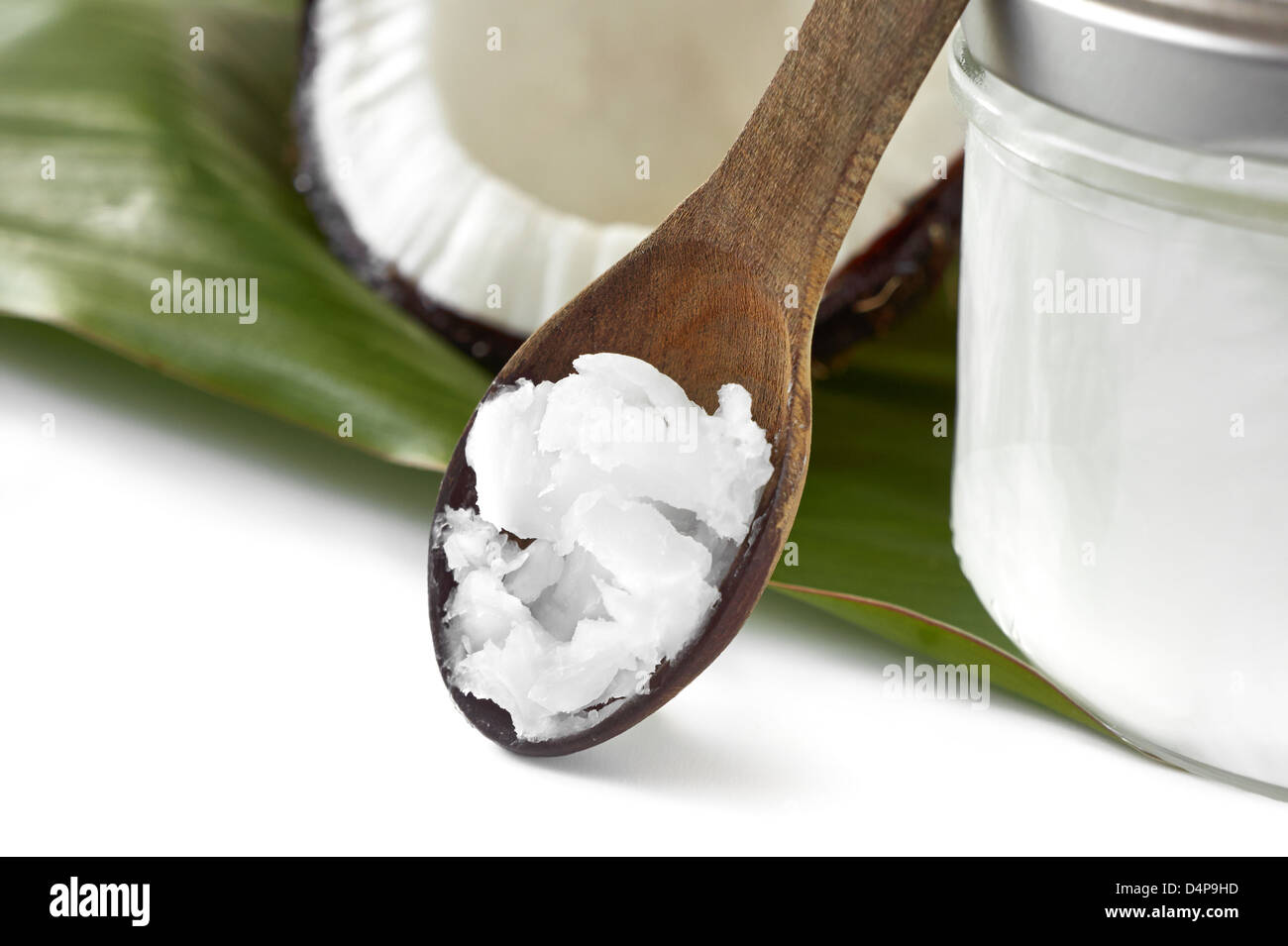 Close-up of coconut oil on the wooden spoon. Beauty and cuisine Stock ...