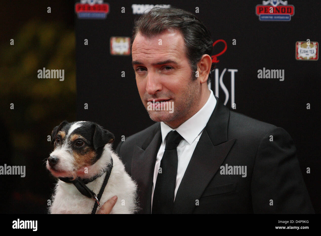 Berlin, Germany, actor Jean Dujardin with movie dog Archie Stock Photo ...