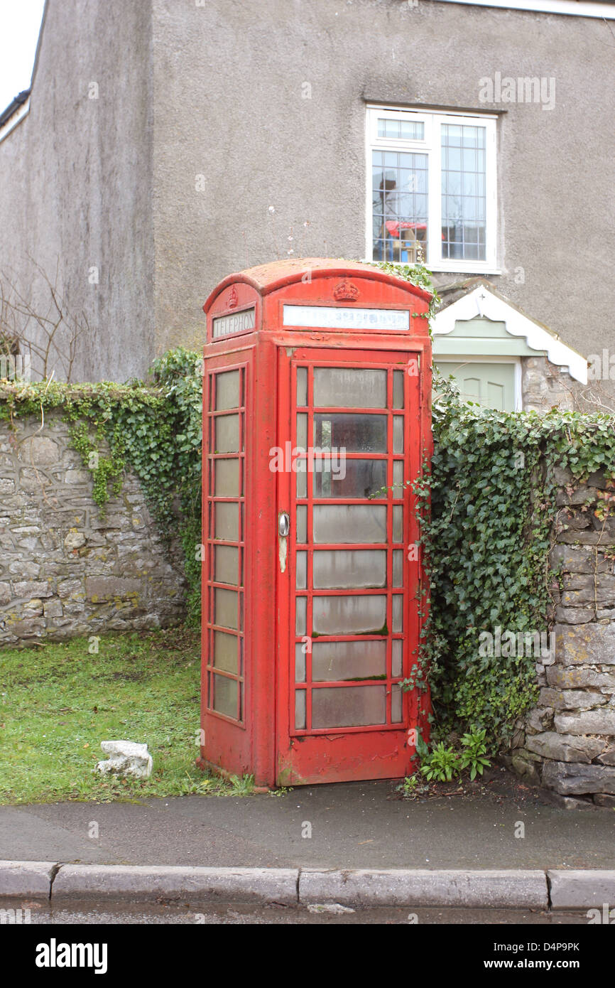 Traditional red British telephone box, now falling into disuse with ...