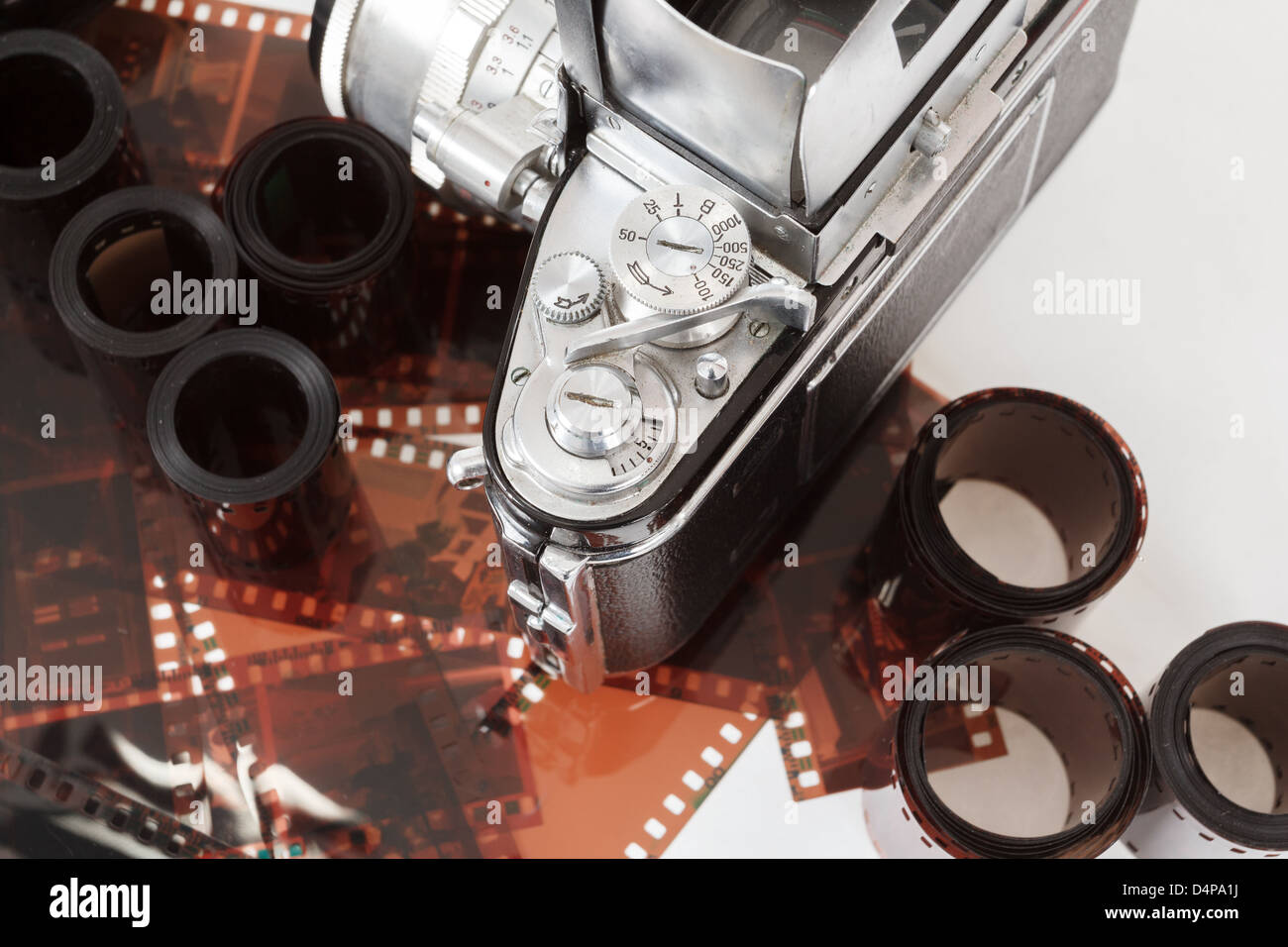 analog vintage SLR camera and color negative films on white Stock Photo ...