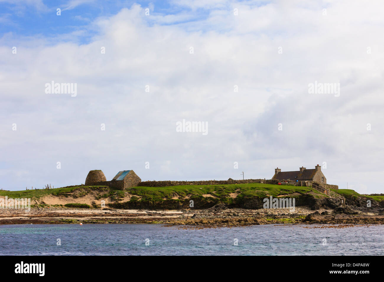Broch and stone building by Visitors Centre on Isle of Noss National ...