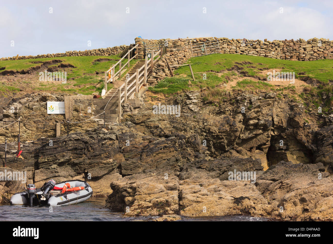 Dinghy by boat landing and steps at entrance for Isle of Noss National ...