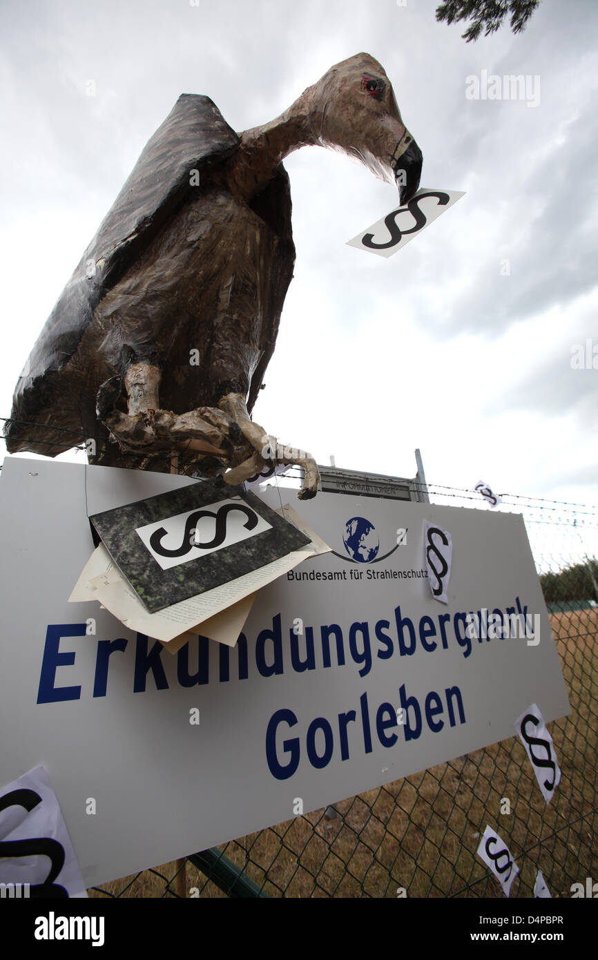 A vulture decorated with paragraph signs sits above the sign of the ...