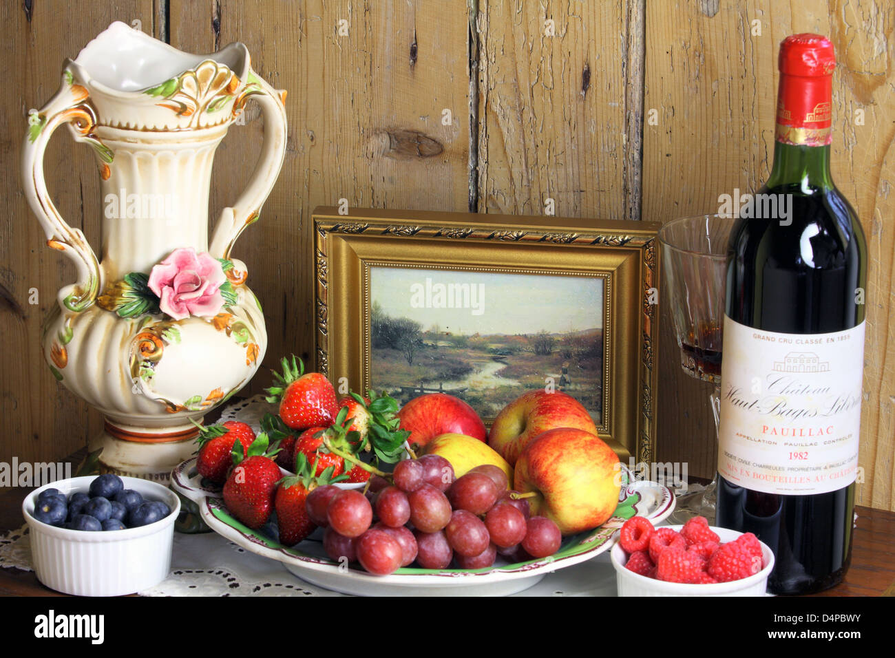 A still life photo of fruit and berries with accompanying vase, small ...