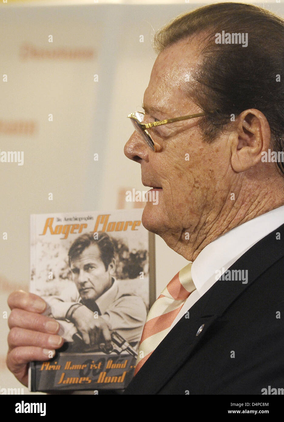 British actor and UNICEF ambassador Roger Moore presents his ...