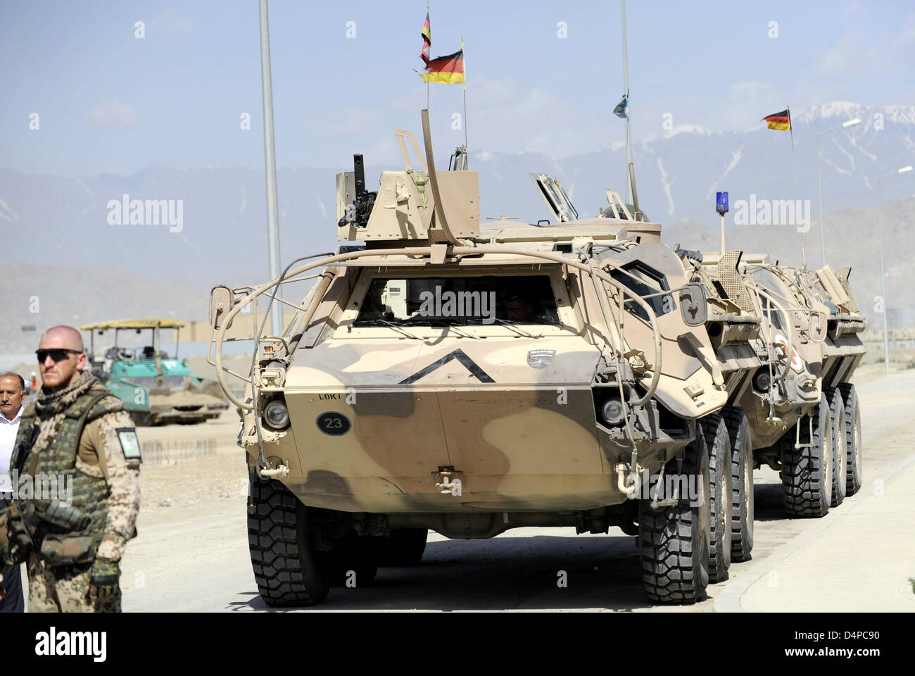 A Bundeswehr soldier stands in front of a transport tank ?Fuchs? at the ...