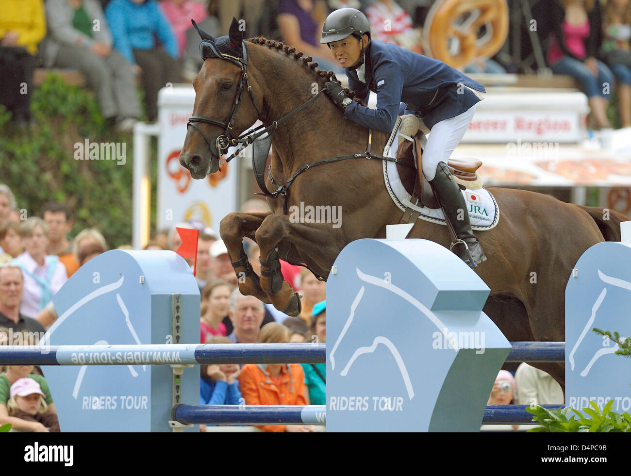 Japanese equestrian Daisuke Fukushima and his horse ?Welldone? take an ...
