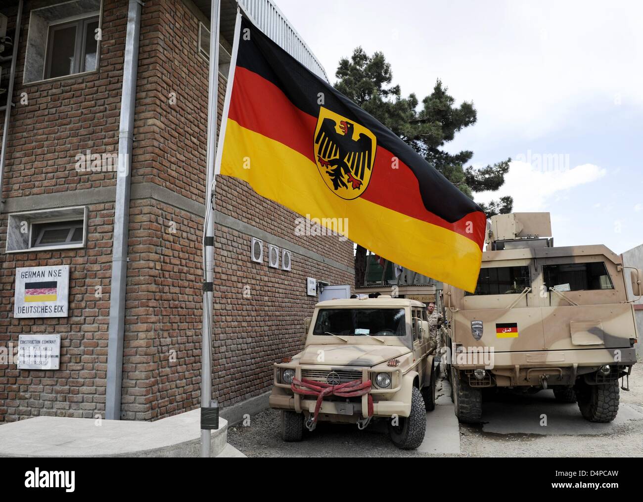 A German flag flies at half mast at the ISAF headquarters in Kabul ...