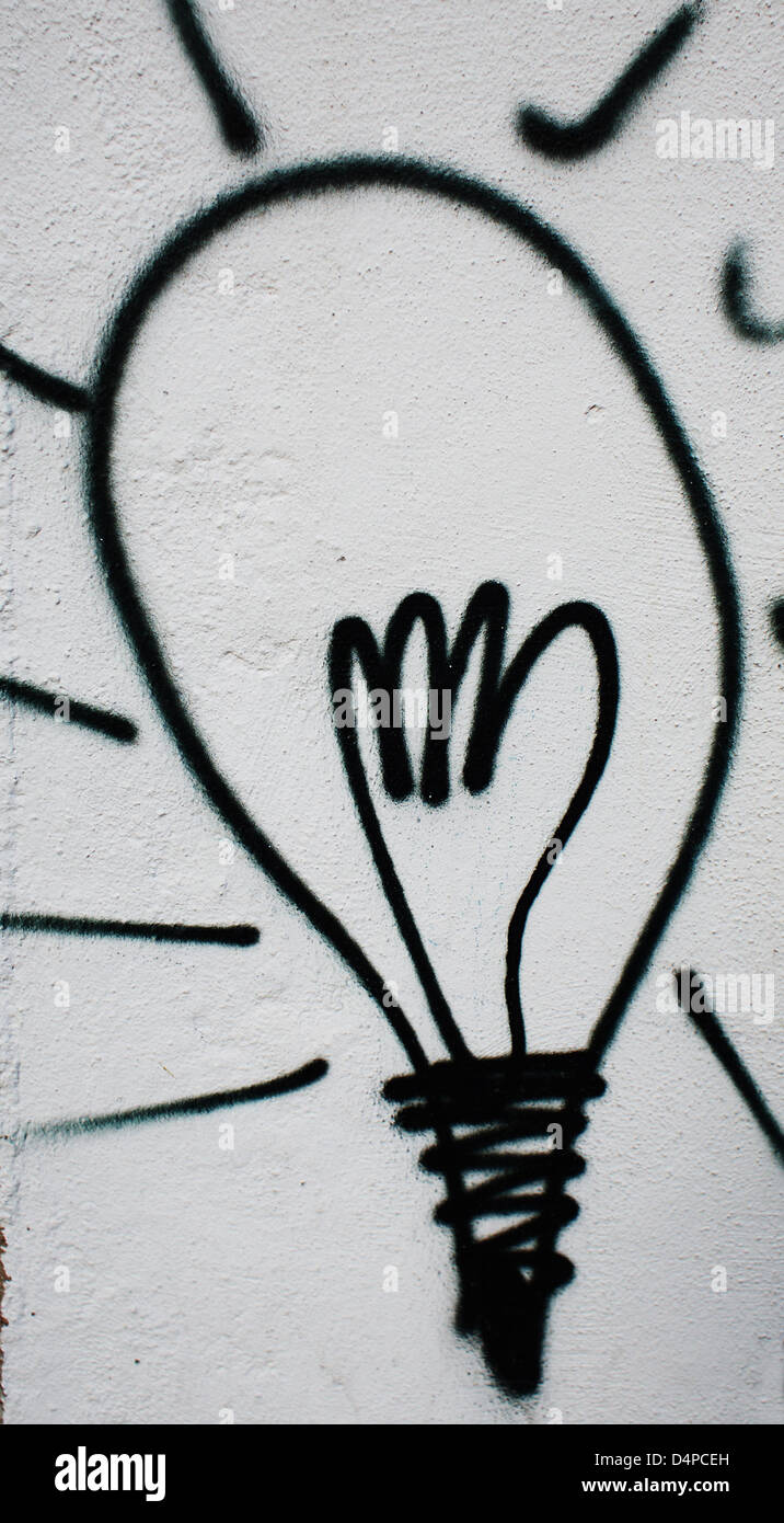 The picture shows a graffiti of a normal light bulb on a wall in ...