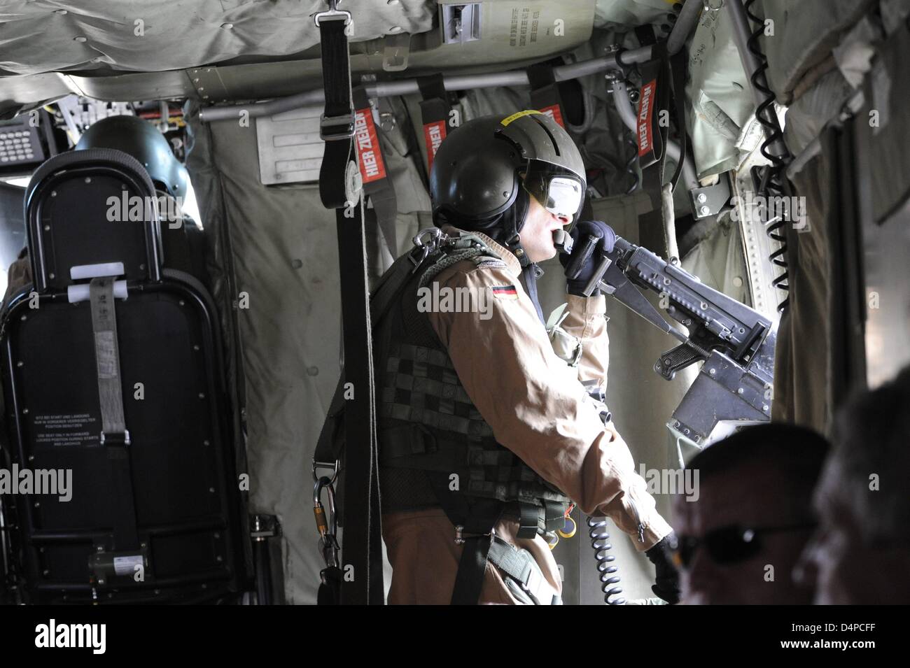 A so-called ?doorgunner? observes the surroundings during a flight in a ...