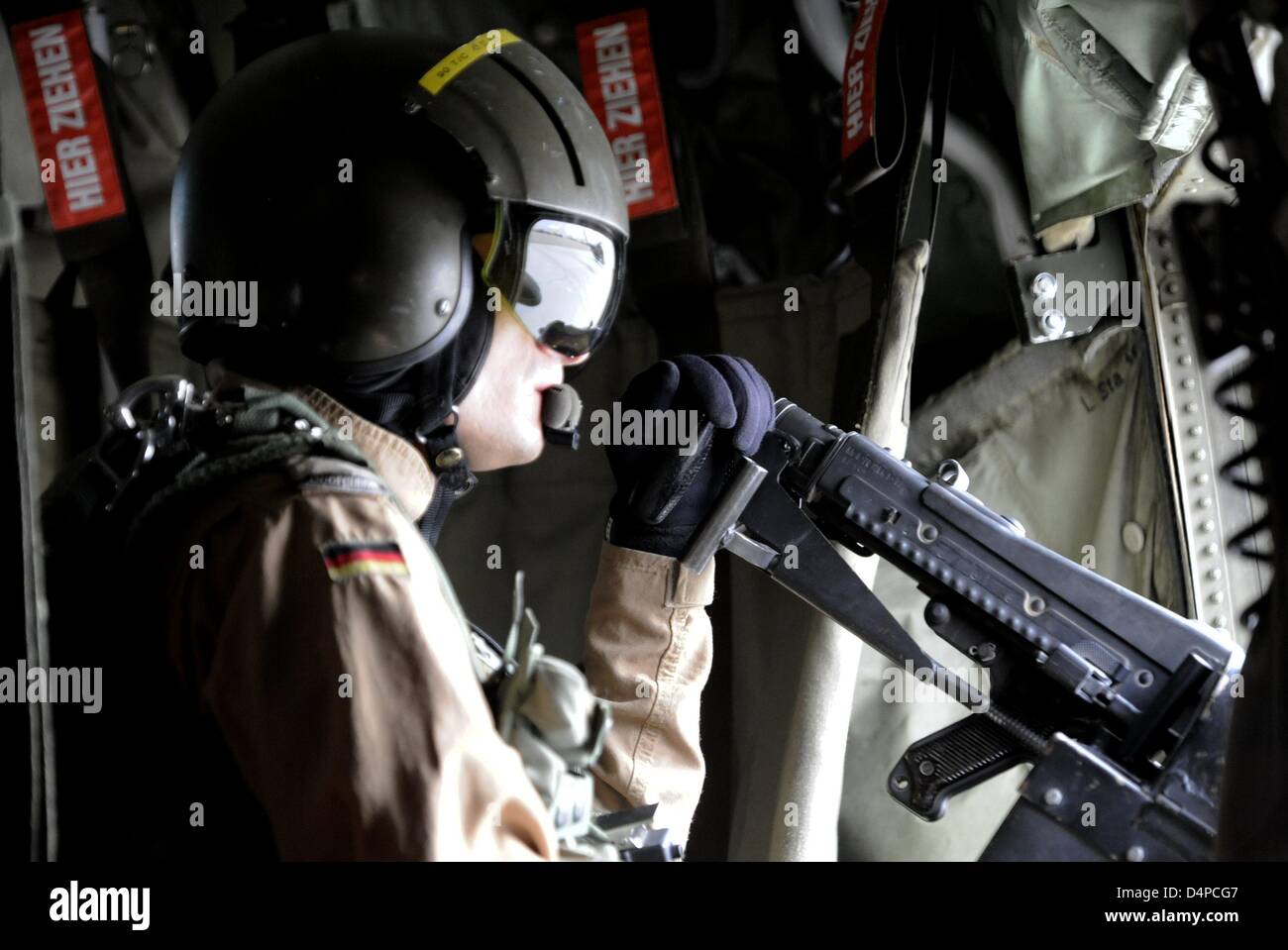 A so-called ?doorgunner? observes the surroundings during a flight in a ...