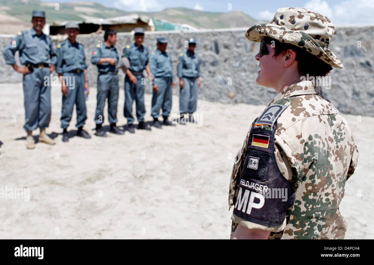 A soldier of the German military police and German policemen of the so ...