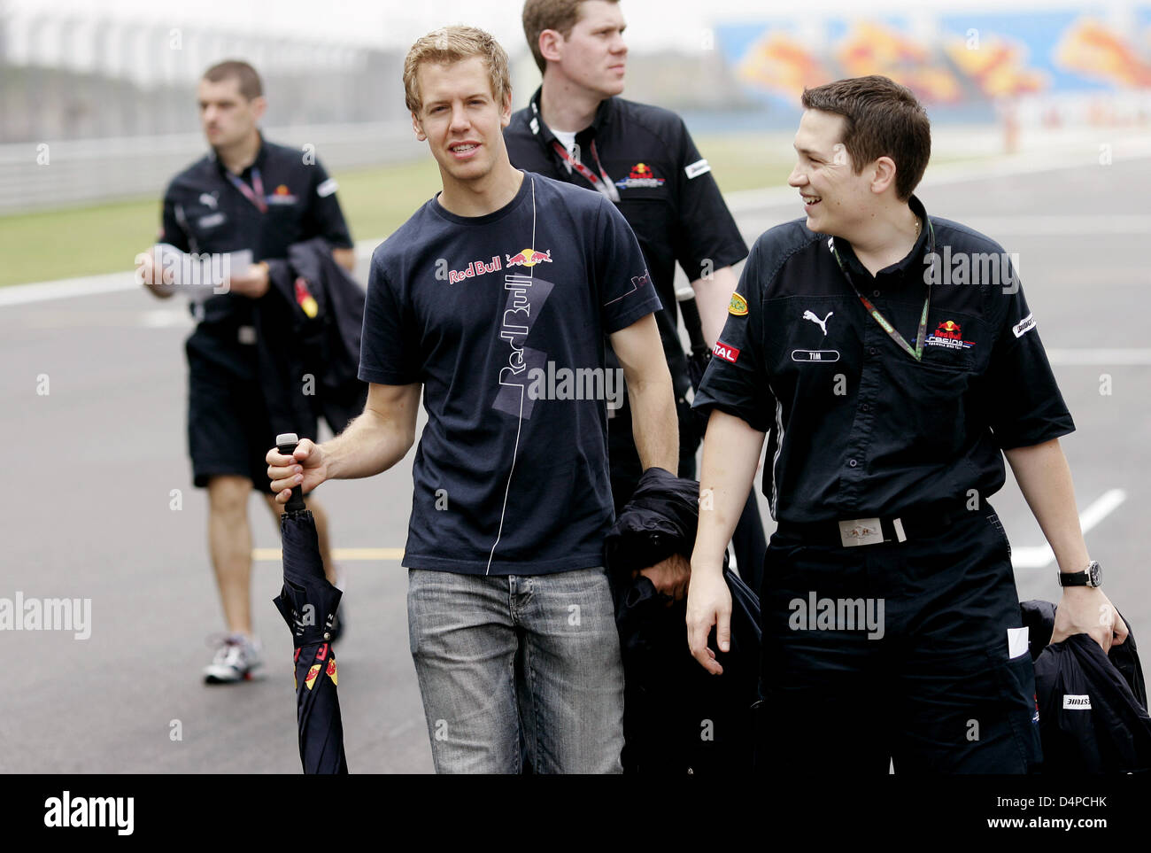 German Formula One driver Sebastian Vettel (C) of Red Bull Racing and ...