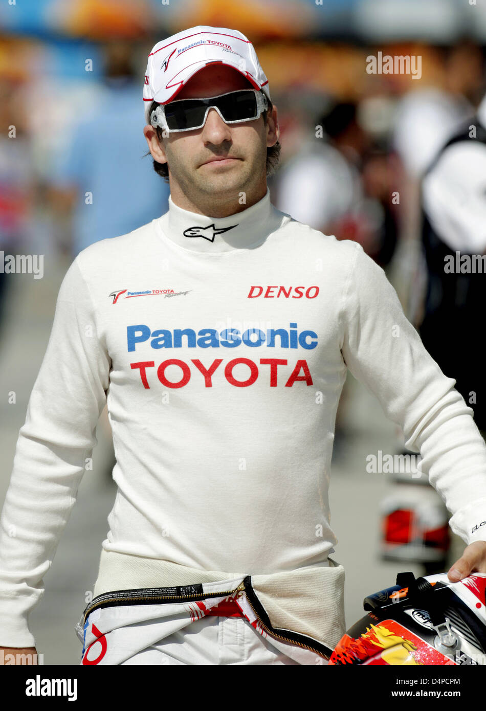 German Formula One driver Timo Glock of Toyota F1 walks through the ...