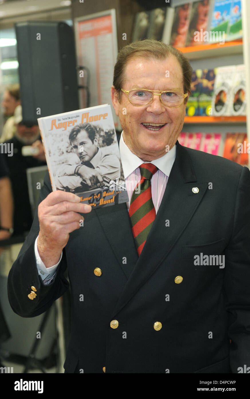 British actor and UNICEF Ambassador Roger Moore presents his ...