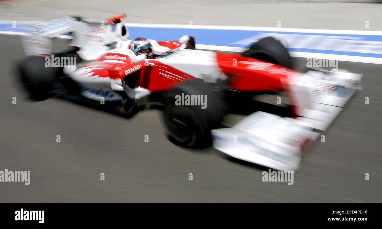 Italian Formula One driver Jarno Trulli of Toyota Racing steers his car ...