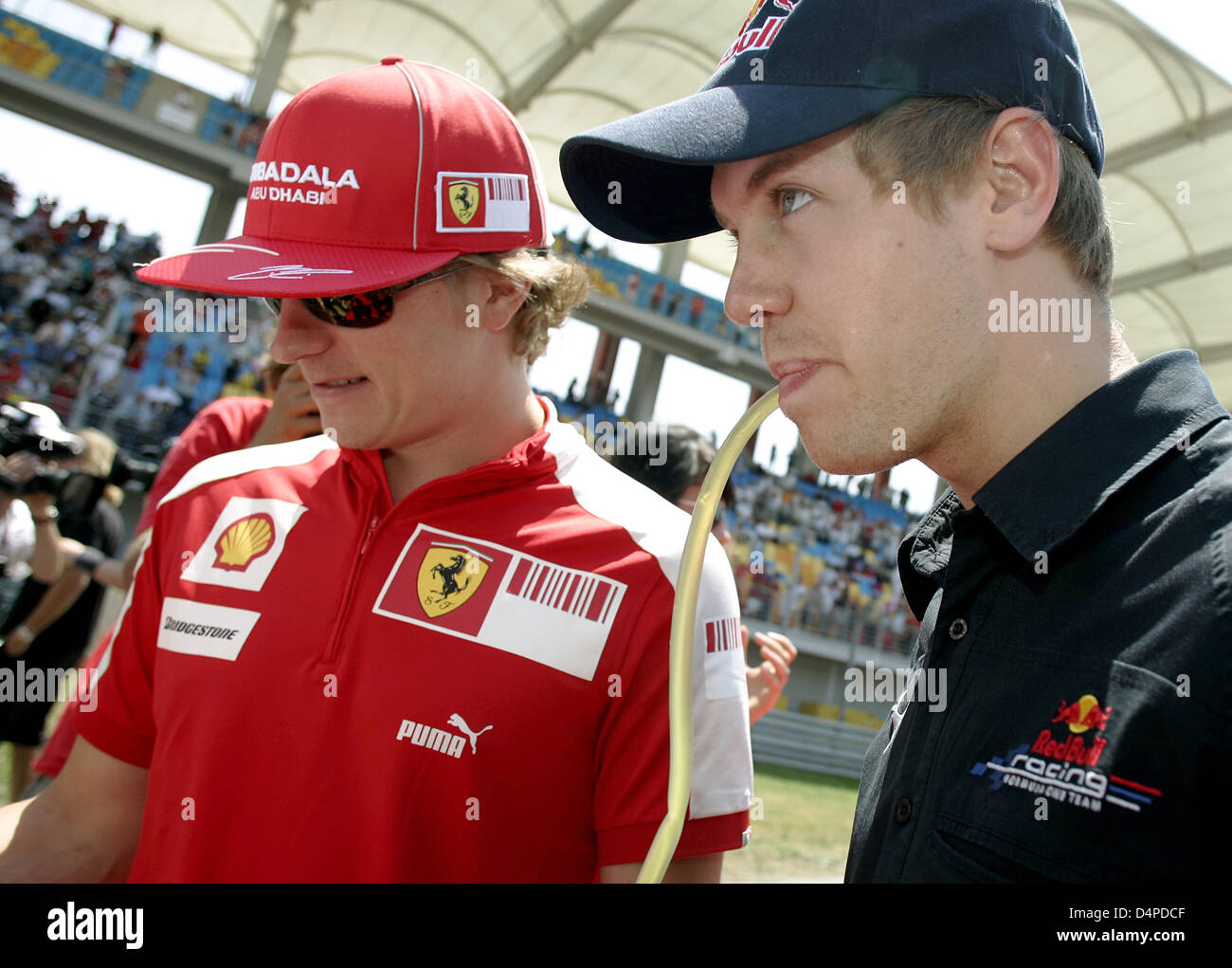 German Formula One driver Sebastian Vettel (R) of Red Bull Racing and ...