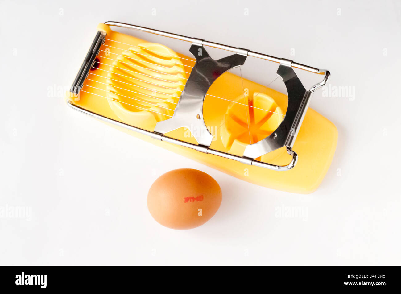 Kitchen instrument to cut boiled eggs Stock Photo - Alamy