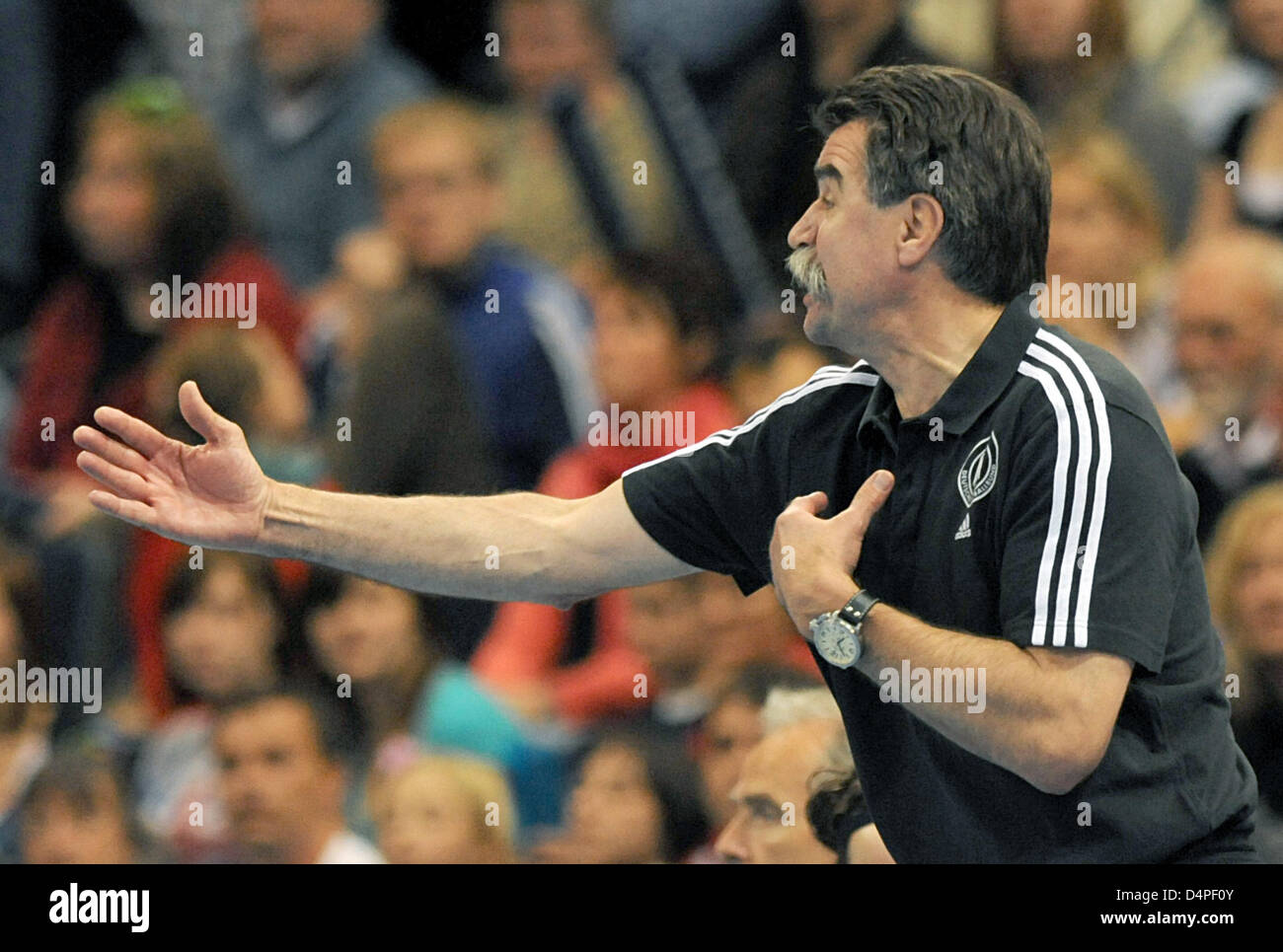 Heiner Brand, head coach of the German national team, gives directions ...