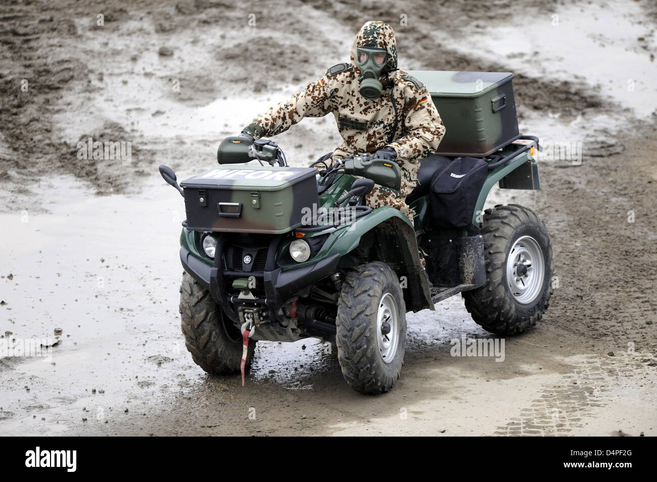 A Bundeswehr soldier drives a quad during the advertisement manoeuvre ...