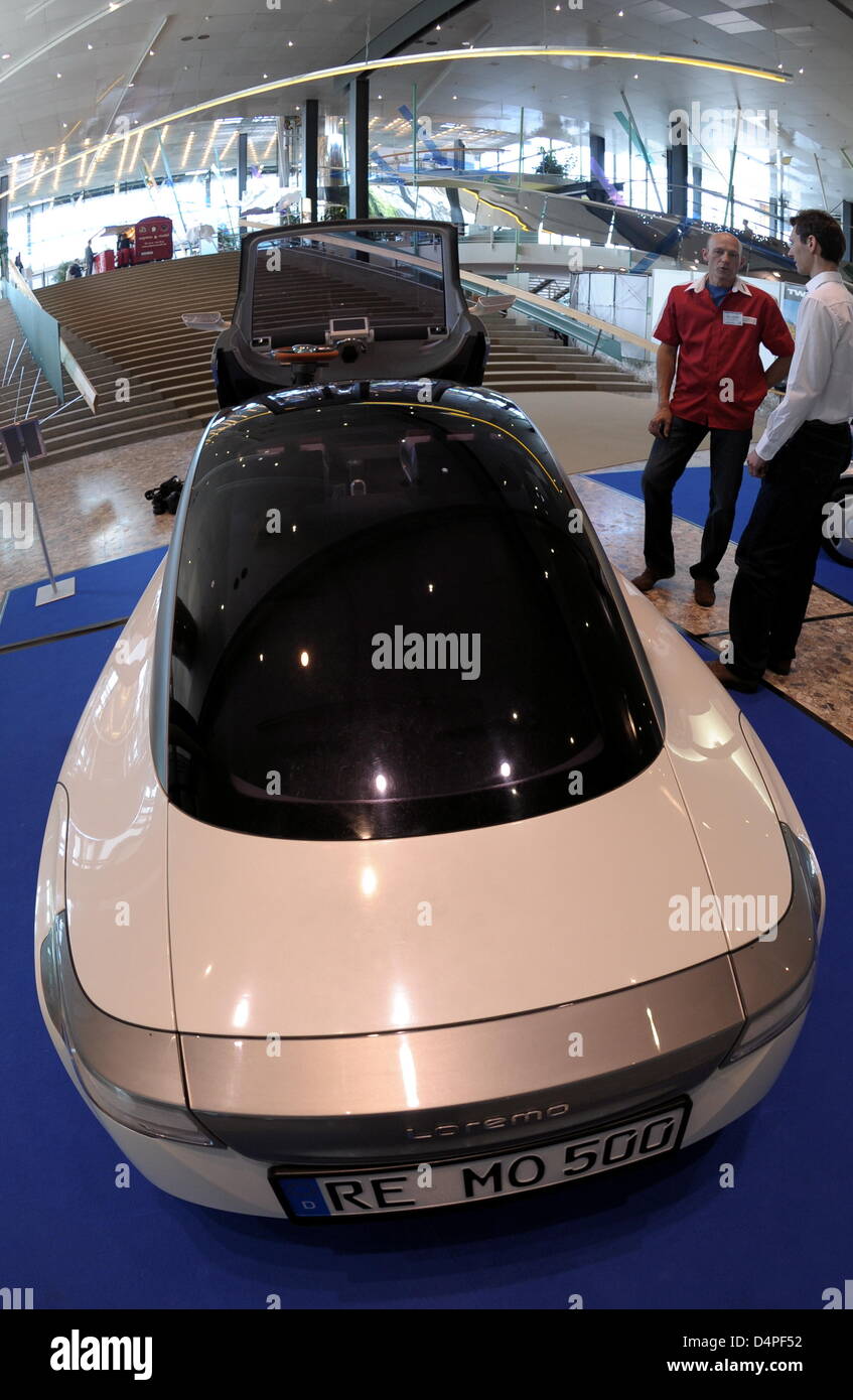Visitors to the First German Electric Vehicle Congress eye a Loremo EV ...