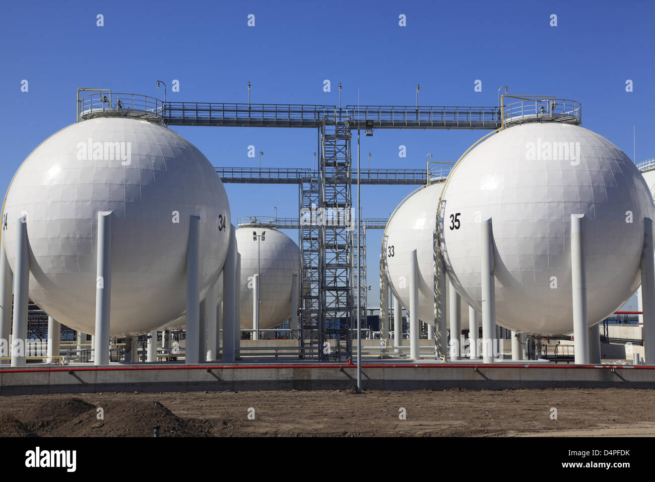 Large oil and gas tanks are pictured in the industrial harbour of ...