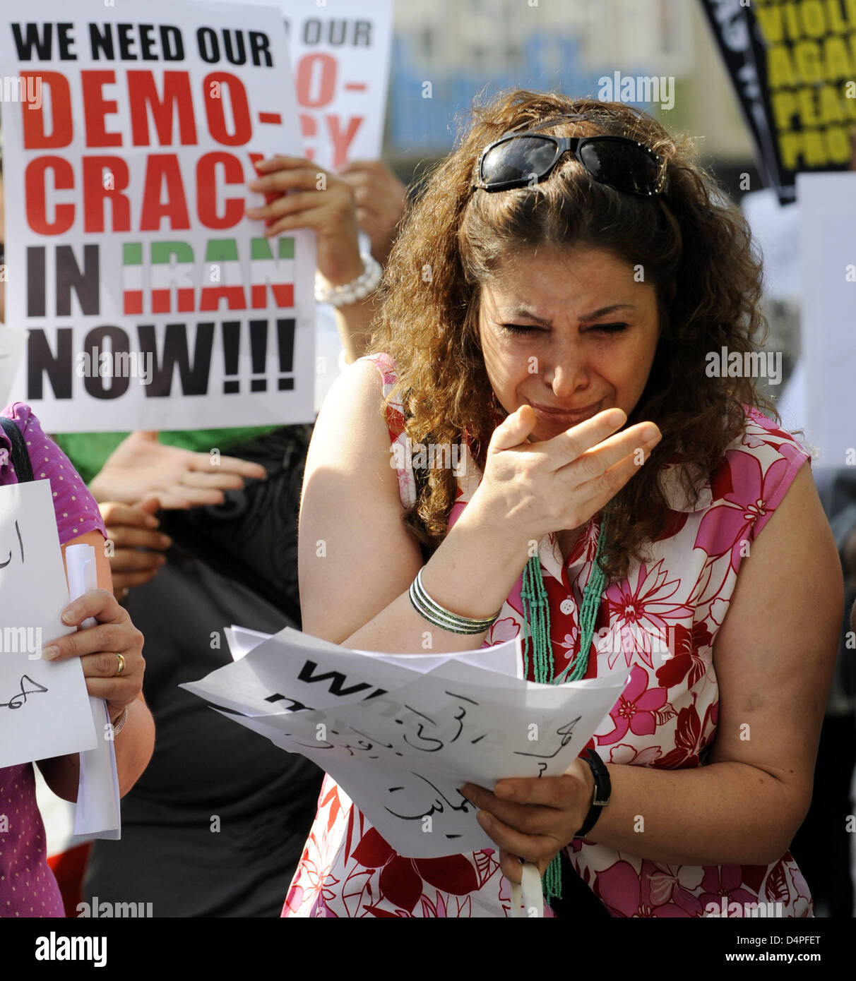A woman cries at a demonstration against the controversial outcome of ...