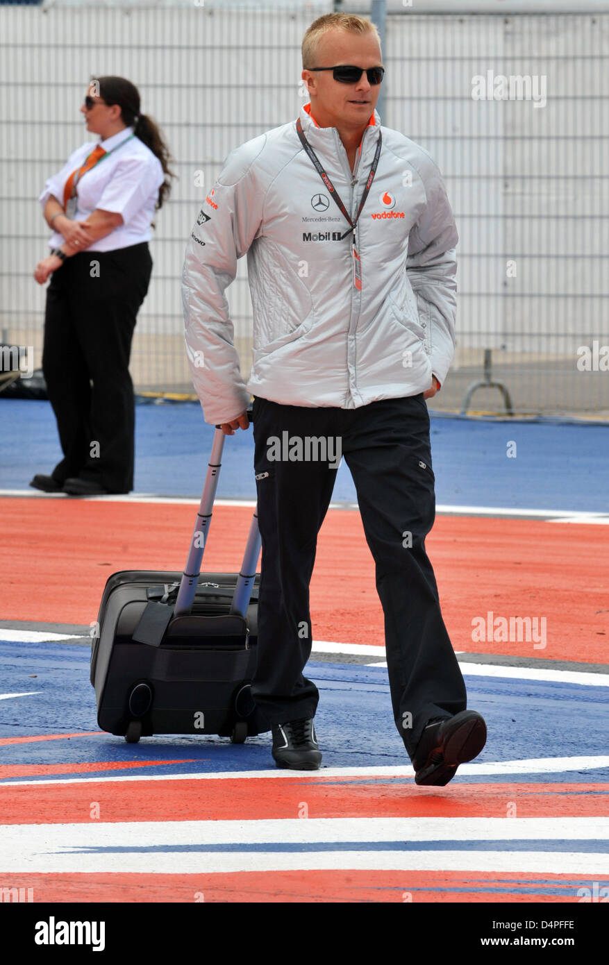 Finnish Formula One driver Heikki Kovalainen of McLaren Mercedes walks ...