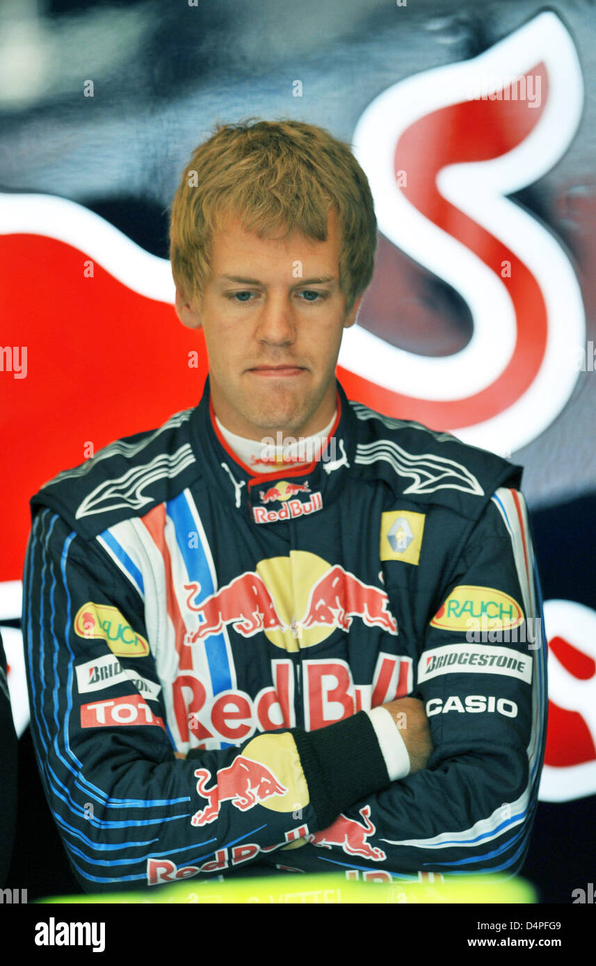 German Formula One driver Sebastian Vettel of Red Bull Racing grimaces ...